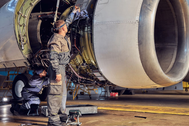 aviation engineer working on plane
