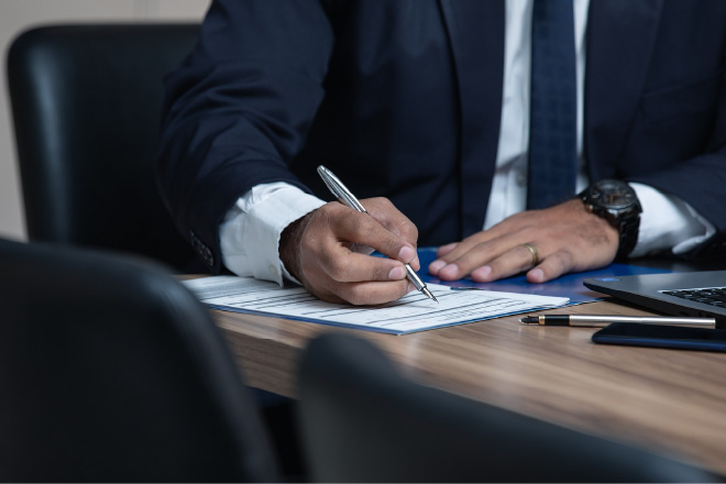 solicitor signing a legal document
