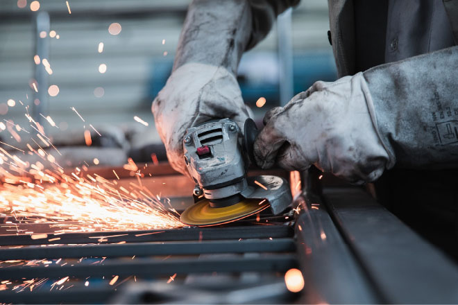 manufacture worker using circular saw